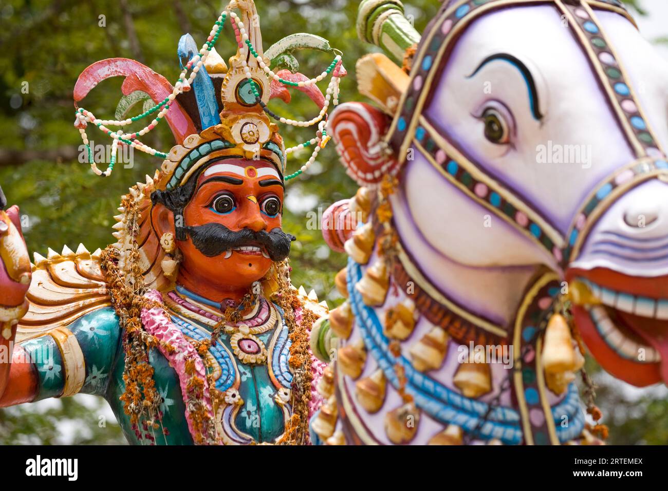 Ornate painted figure at a Hindu Temple in South India near Auroville ...