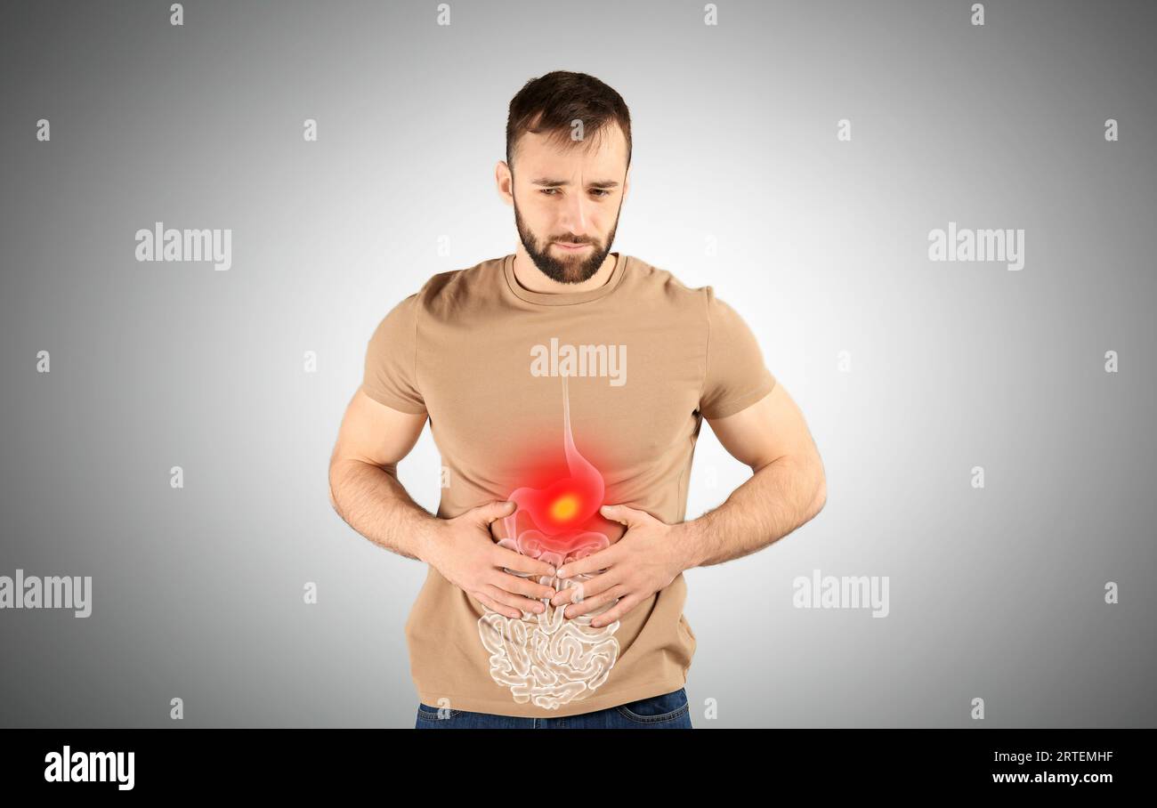 Healthcare service and treatment. Man suffering from abdominal pain on ...