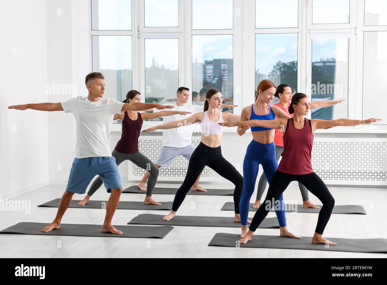 Yoga teacher helping woman asana hi-res stock photography and images ...
