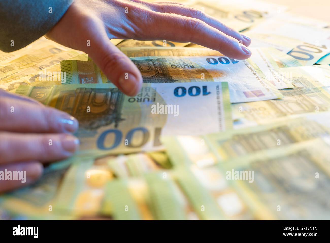 counting money.Hands collecting money.Cash settlement .100 euro ...