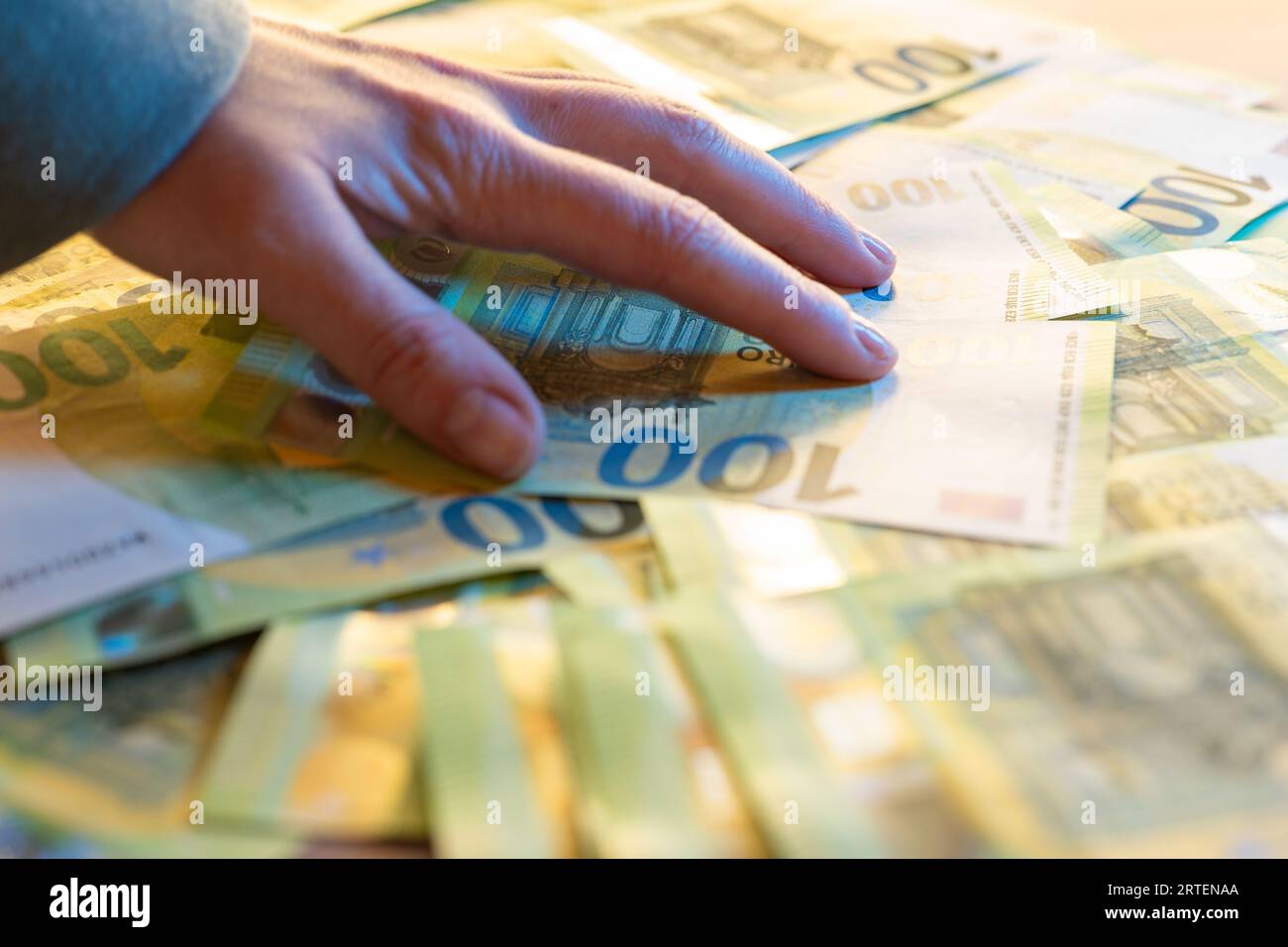 Money theft. Money crimes. Hands counting money in blue light Stock ...