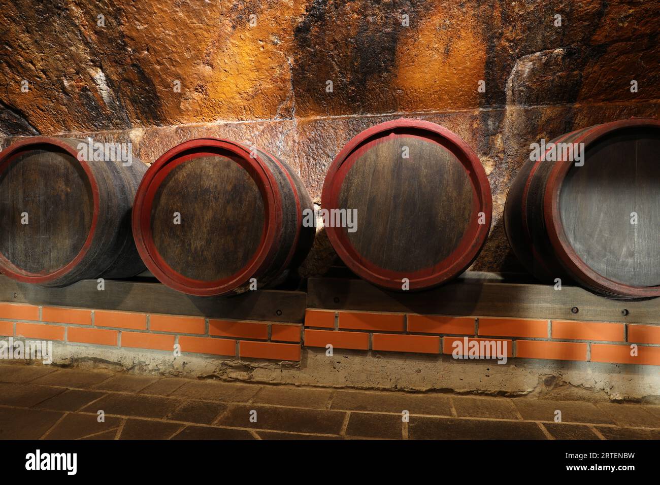 Many wooden barrels with alcohol drinks in cellar Stock Photo - Alamy