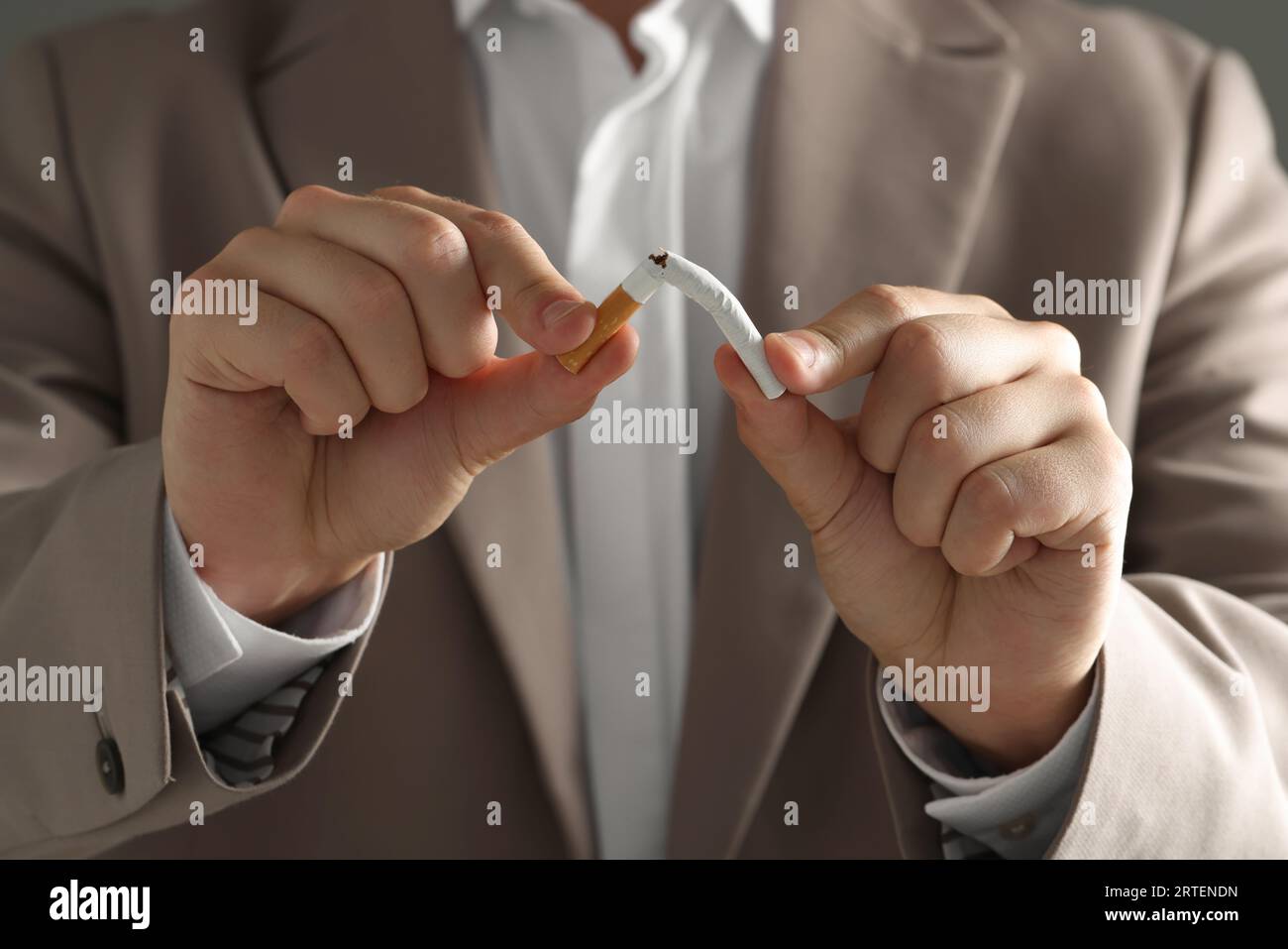 Stop smoking concept. Man breaking cigarette, closeup Stock Photo - Alamy