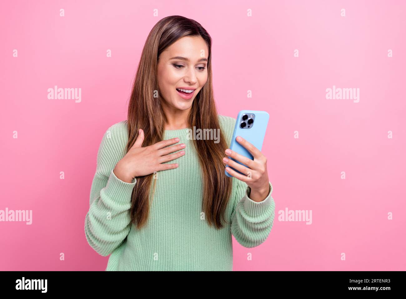 Photo of surprised funny girl brown hair watching her tik tok videos ...