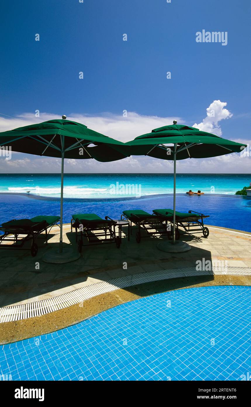 Swimming pool overlooks the Caribbean Sea at a resort in Cancun; Cancun ...