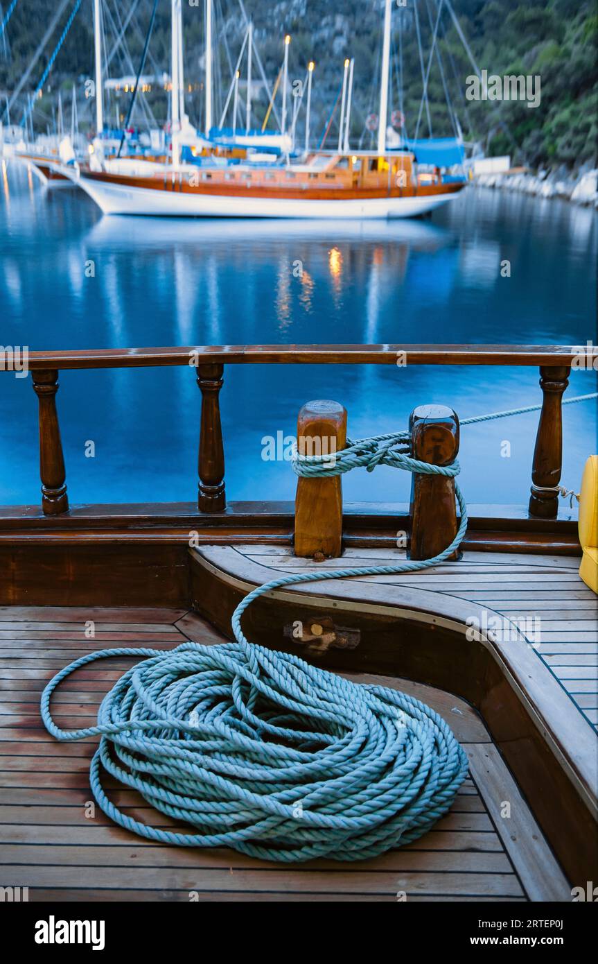 Sailing yachts at anchor in striking blue waters; Ekincik Bay, Turkey ...