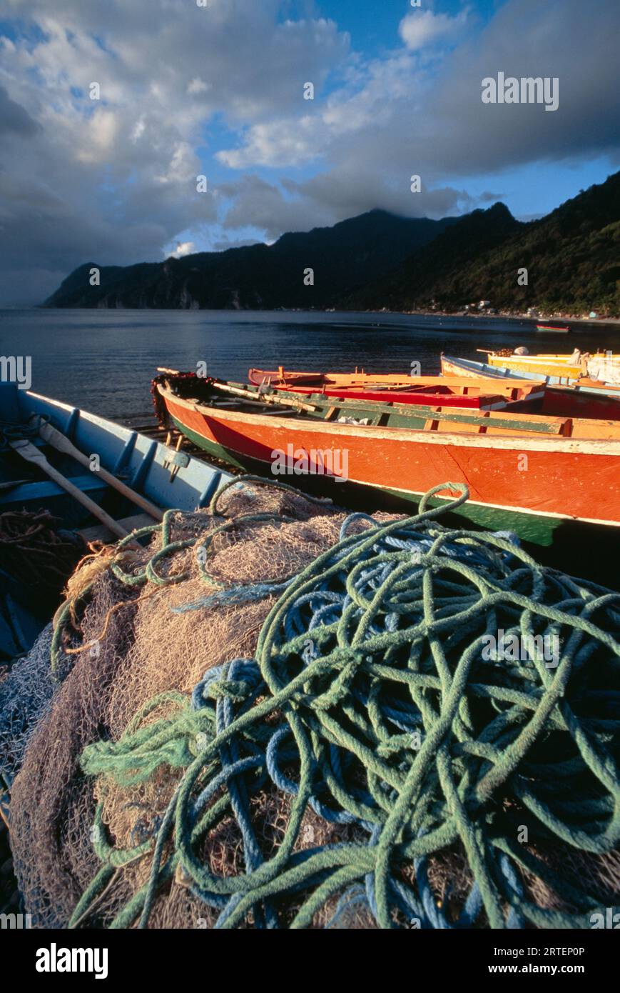Fishing boat rests on the rocky shore of Scotts Head; Commonwealth of ...