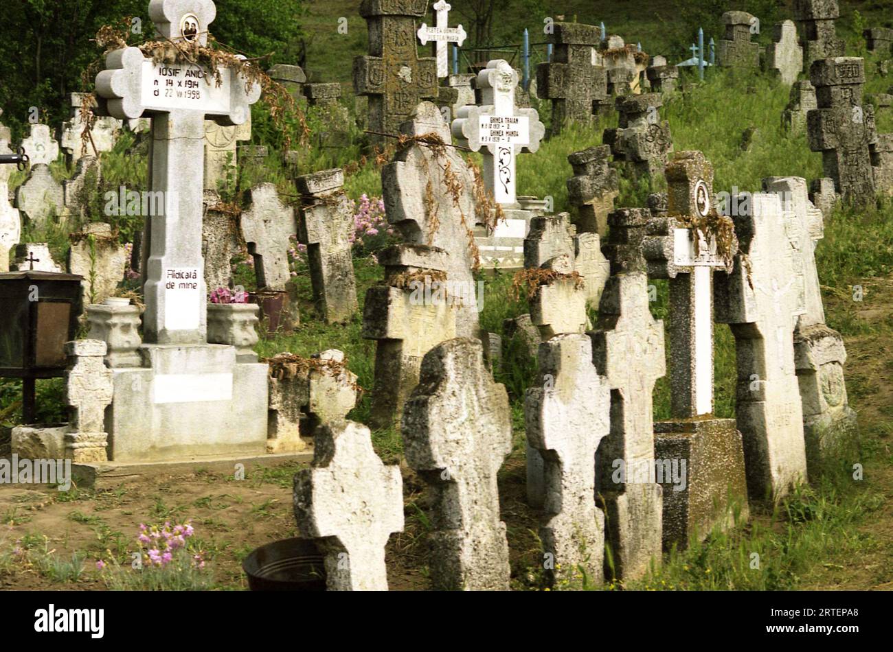 Copuzu, Ialomița County, Romania, 2000. The local cemetery, with many ...