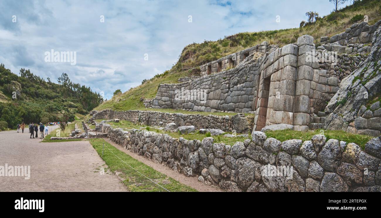 Cusco, Peru. 2023. Tourist exploring the temple complex of the Inca ...