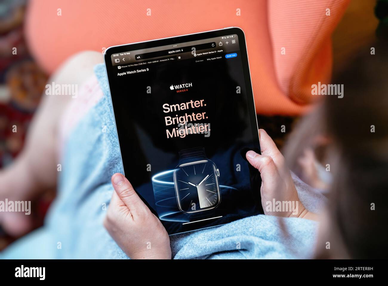 London, UK - Sep 13, 2023: Woman reads the slogans 'Watch Series 9 ...