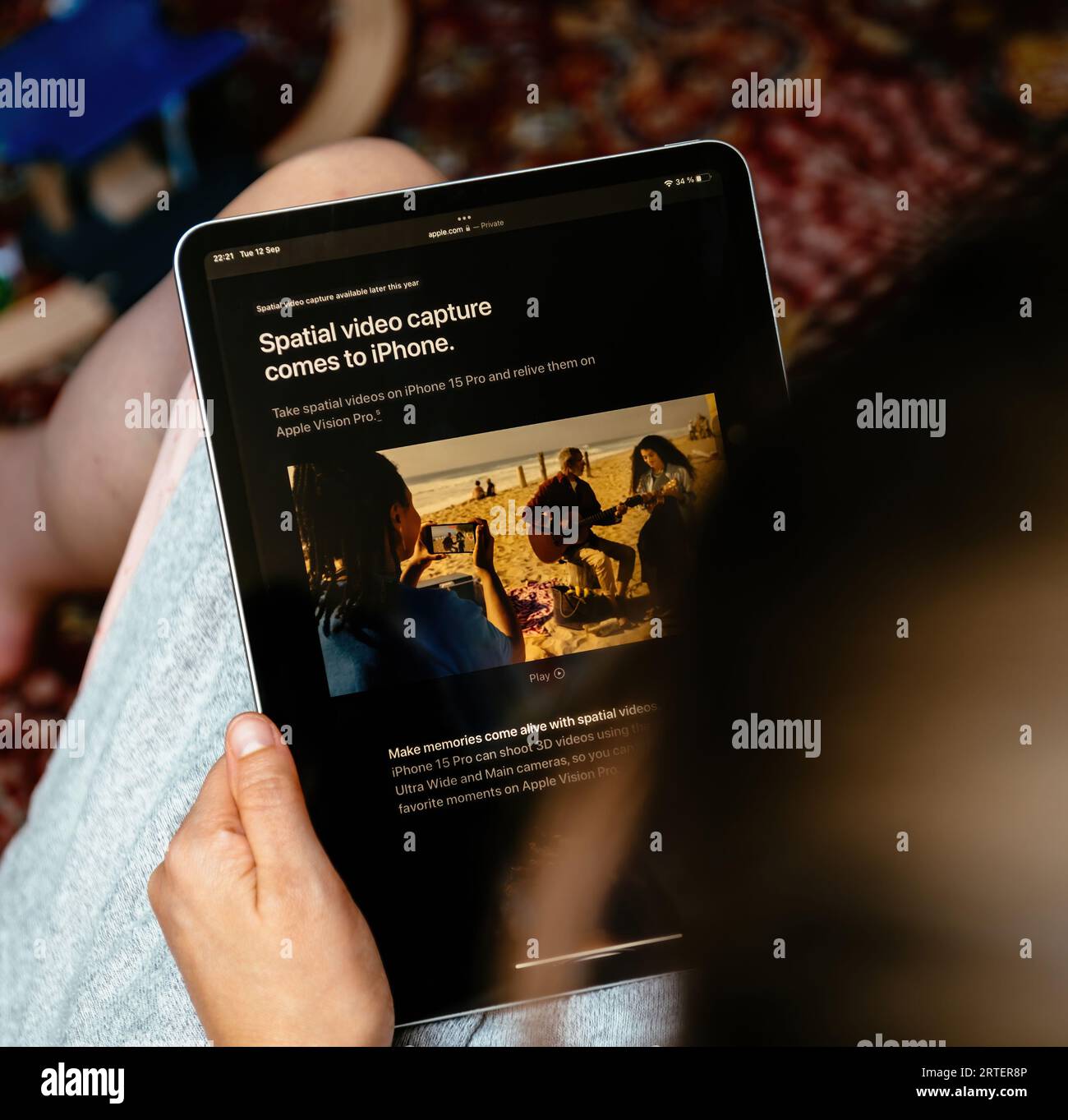 London, UK - Sep 13, 2023: Woman reads an announcement on Apple's ...