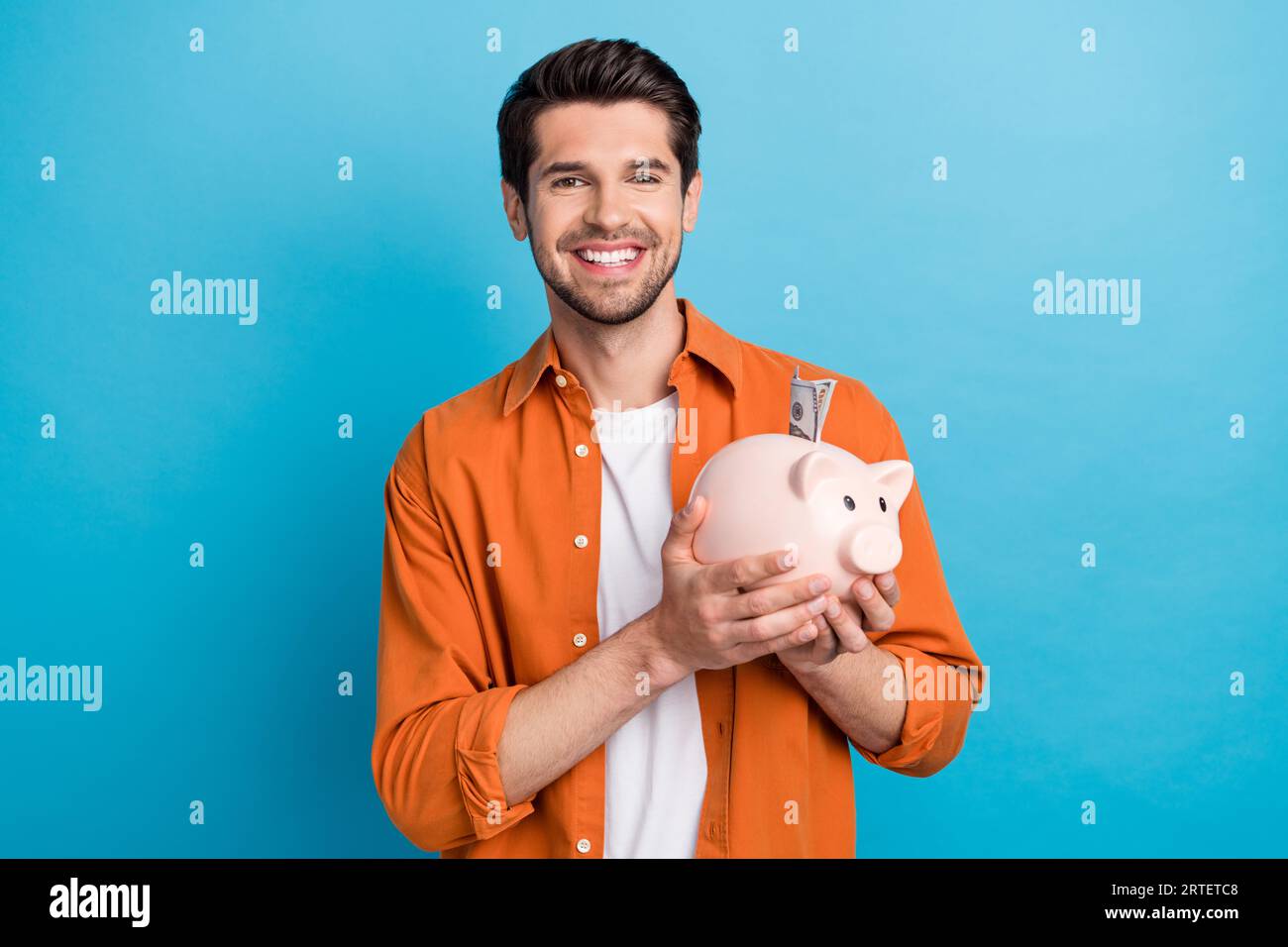 Portrait of cheerful wealthy nice man toothy smile hands hold money ...