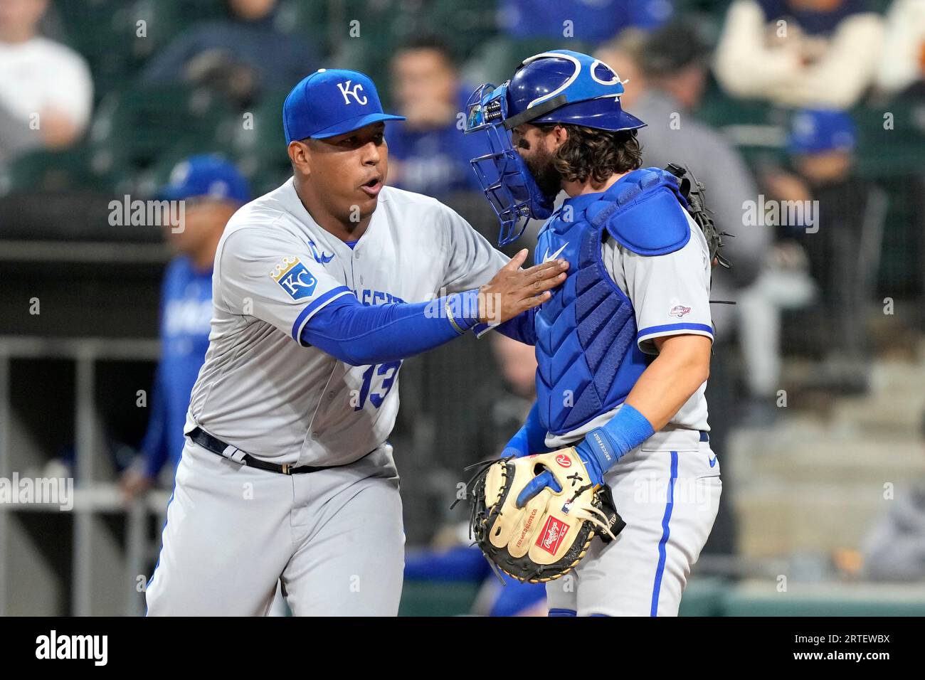 Kansas City Royals' Salvador Perez (13) encourages catcher Logan Porter ...