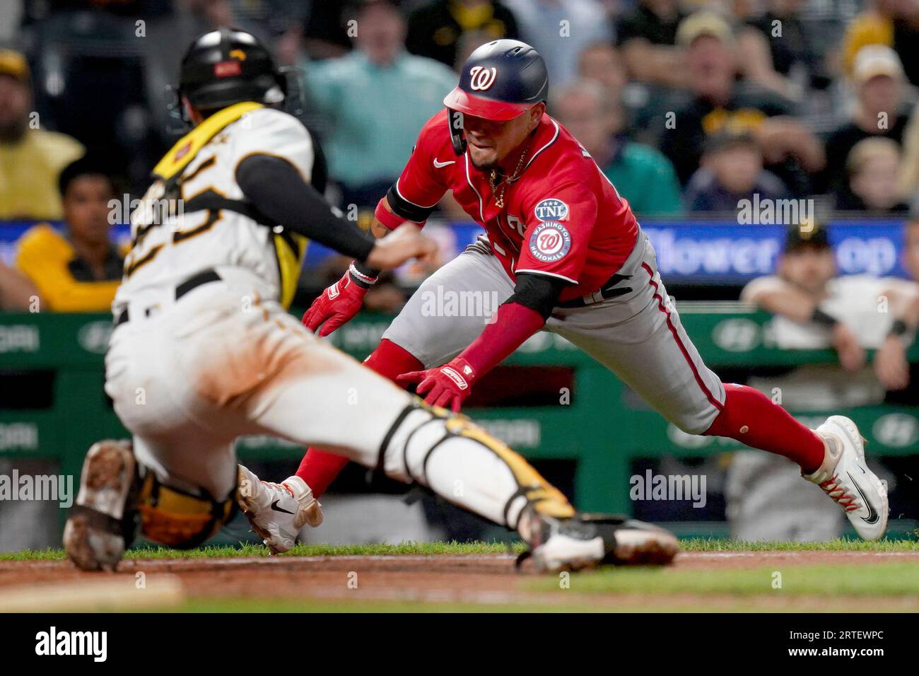 Pittsburgh Pirates catcher Endy Rodriguez reaches to tag out Washington ...
