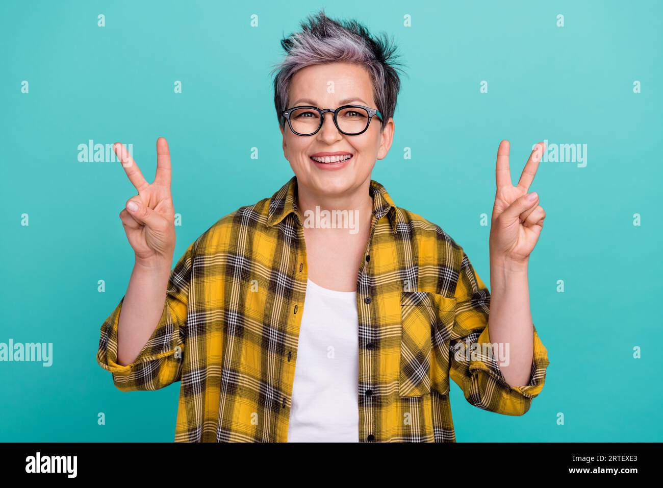 Portrait of cheerful nice senior age lady showing v sign symbol hi ...