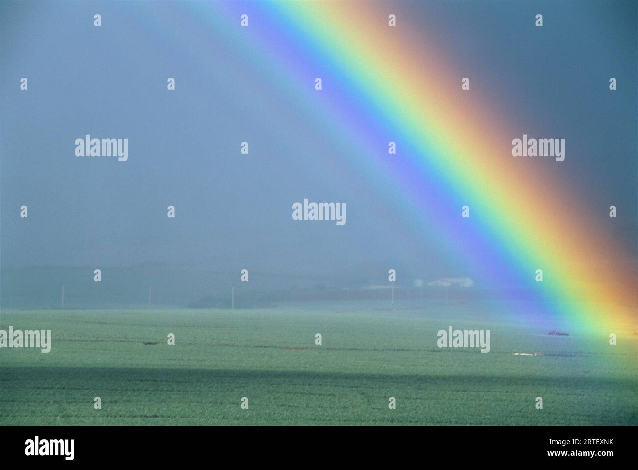 Hawaii, Maui, Faint Portion Of Rainbow Over Fields, Misty Sky Stock ...