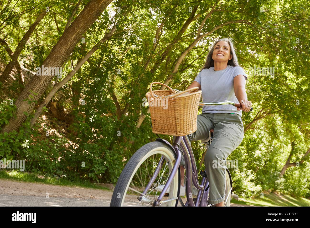 Smiling Mature Woman Riding Bicycle Hi Res Stock Photography And Images