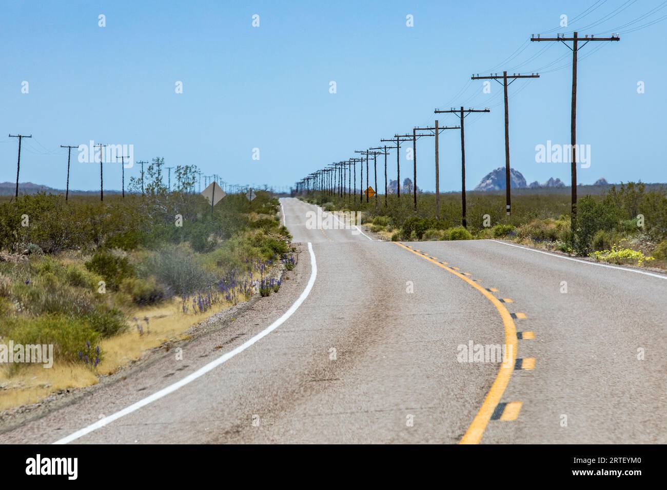 USA, California, Barstow, Mojave National Preserve, Empty highway and ...