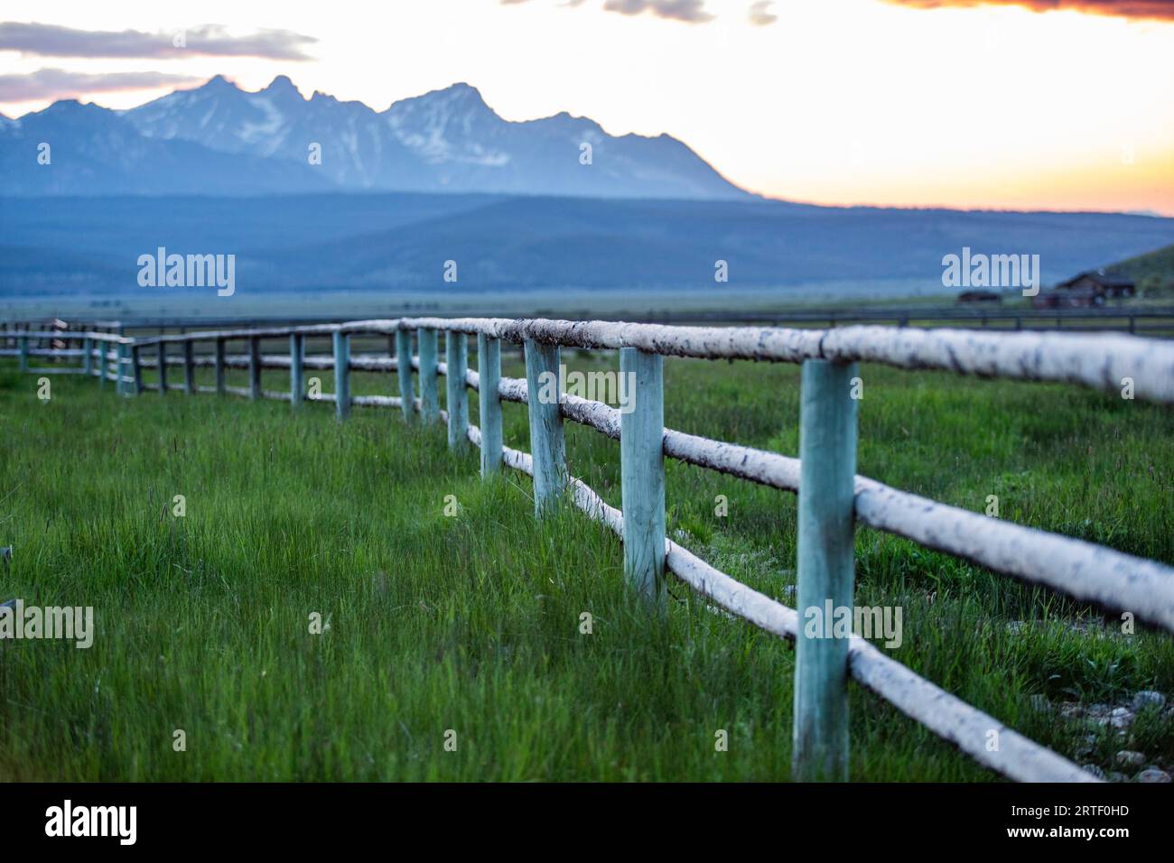 USA, Idaho, Stanley, Scenic view of Sawtooth Mountains and meadow with ...