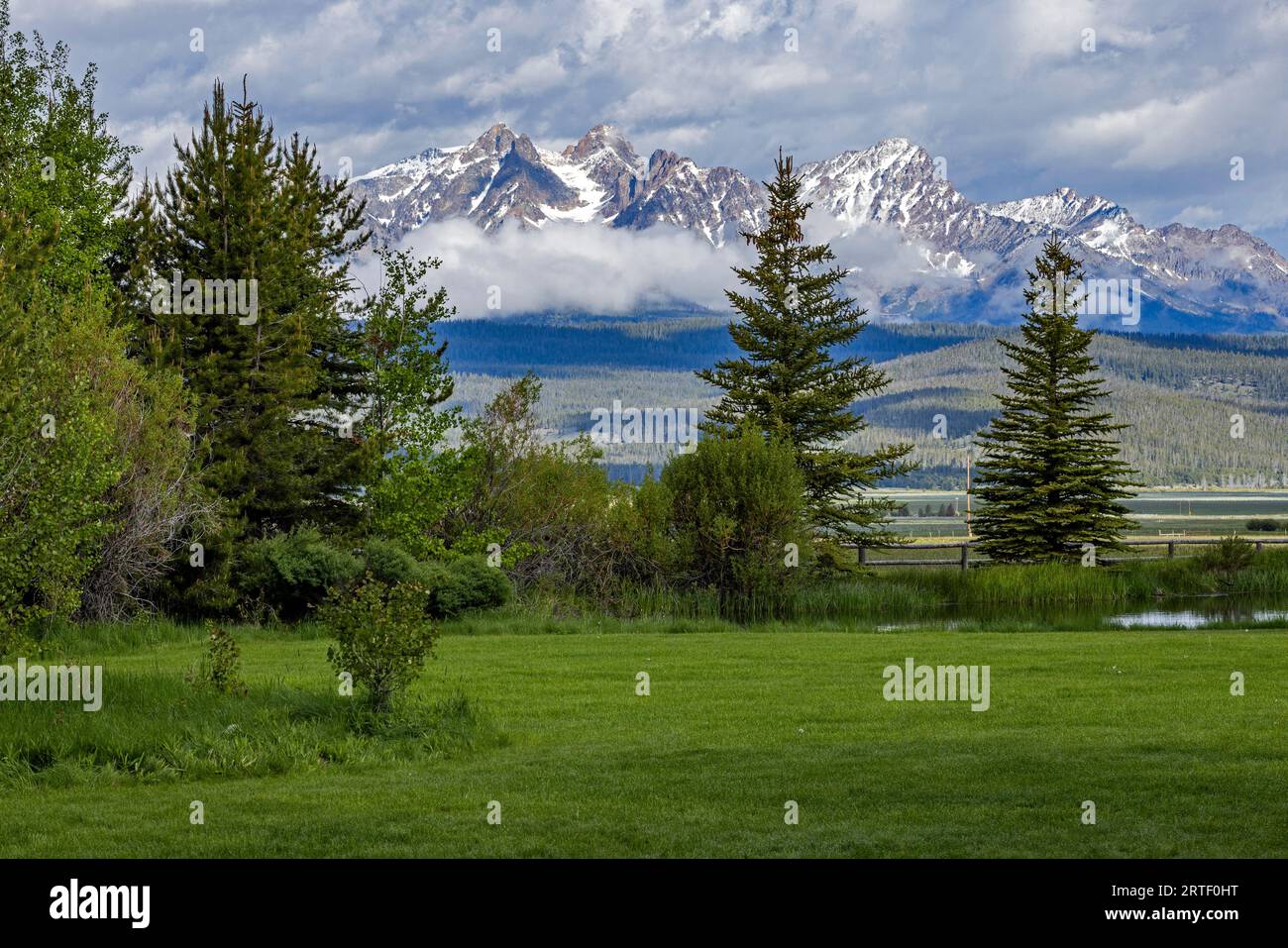 USA, Idaho, Stanley, Scenic landscape with trees and Sawtooth Mountains ...
