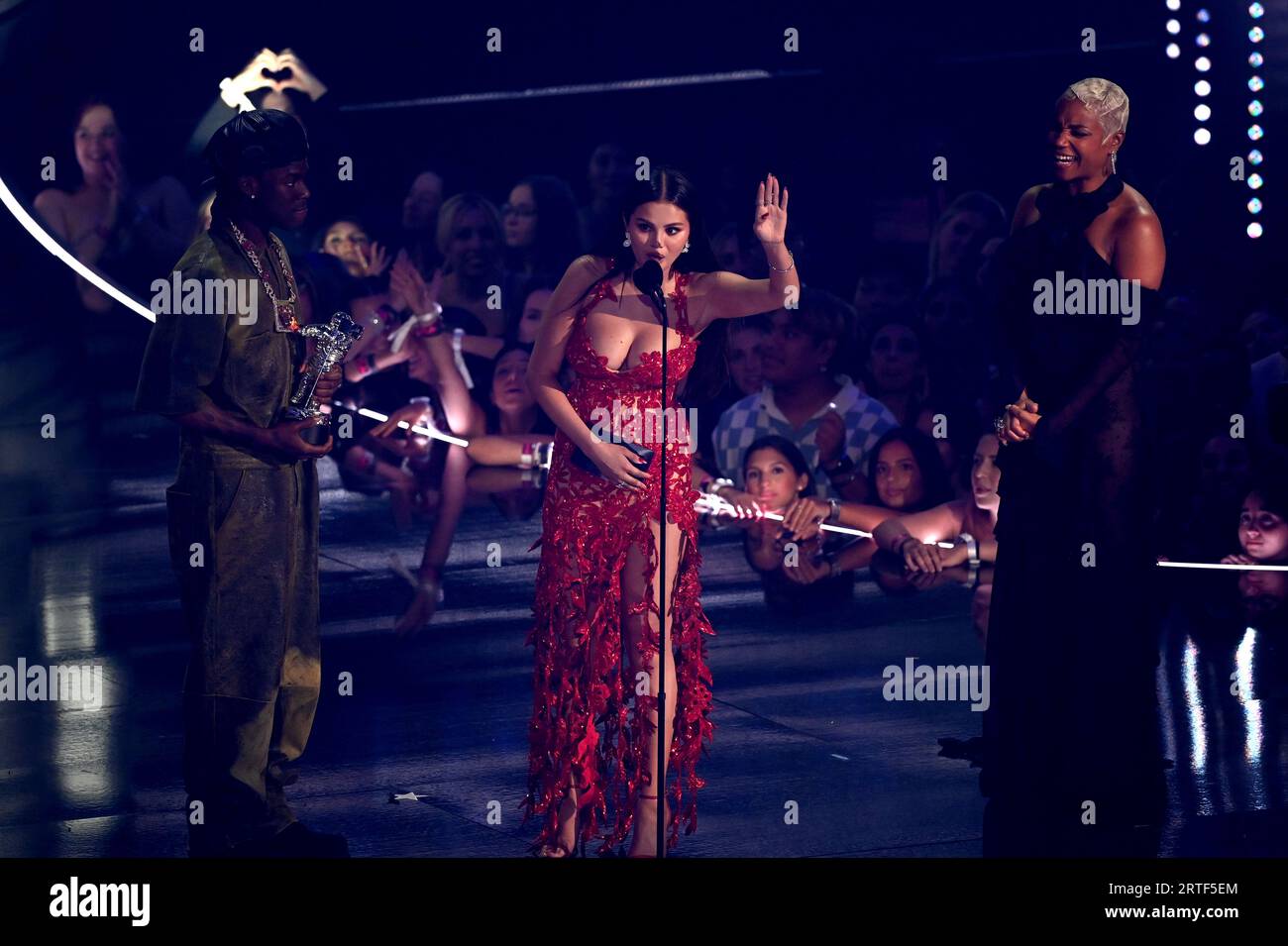 Rema and Selena Gomez on stage after winning the Best Afrobeats award ...