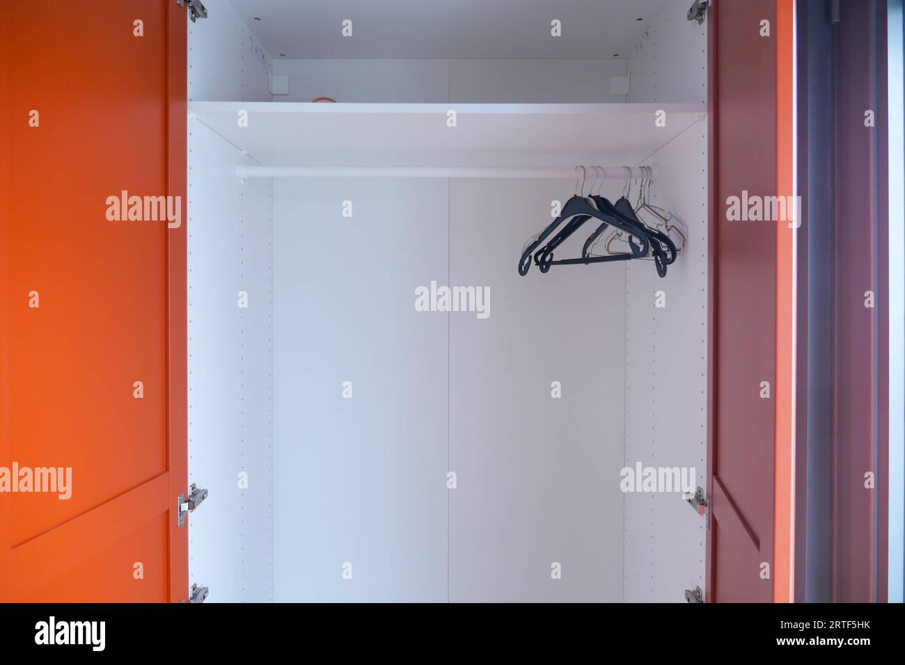 hand opening bedroom cabinet door Stock Photo - Alamy