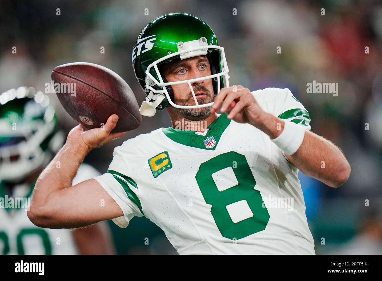 New York Jets quarterback Aaron Rodgers (8) warms up before an NFL ...
