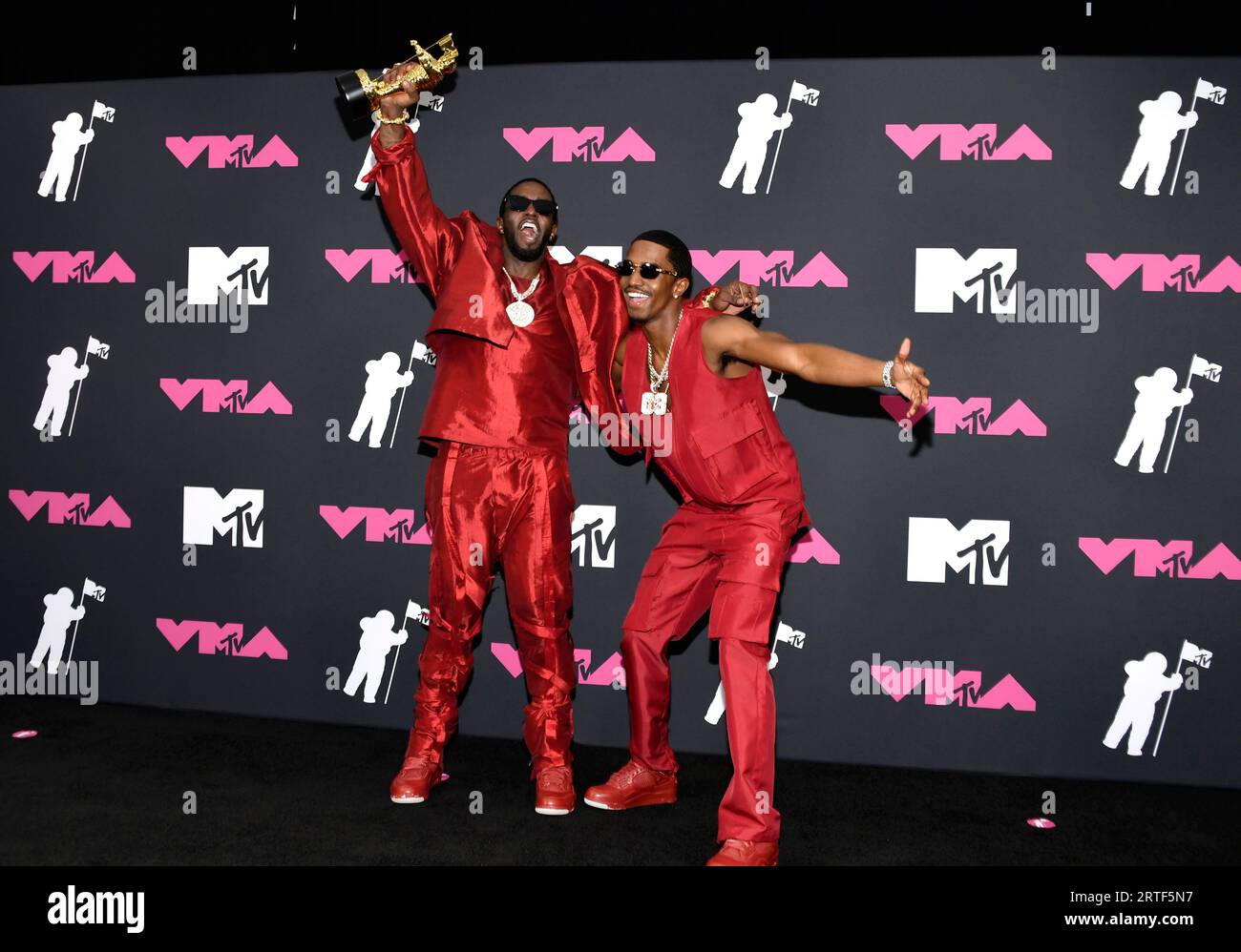 Sean "Diddy" Combs, left, winner of the global icon award, and Christian "King" Combs pose in ...
