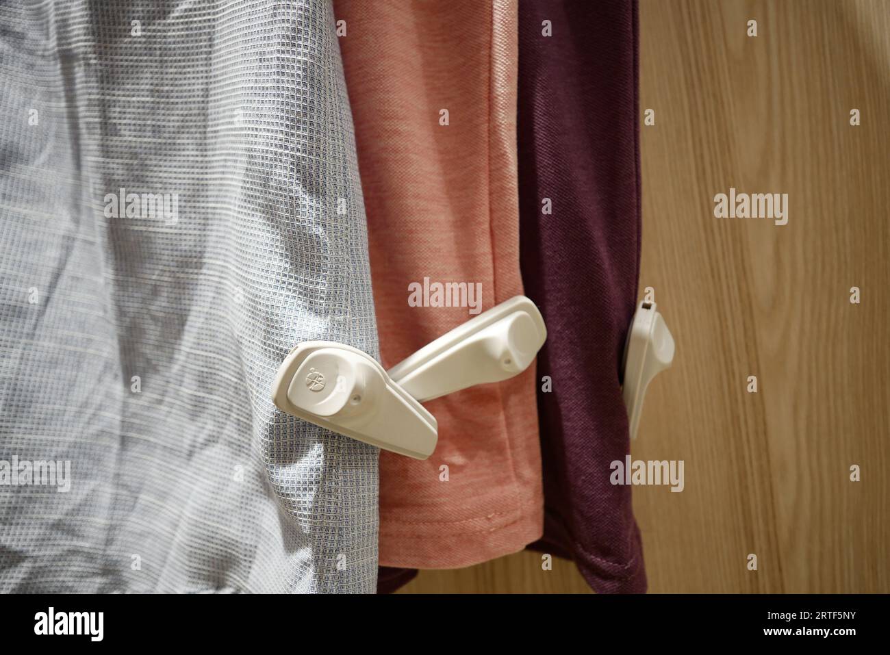 Security tags on clothes hi-res stock photography and images - Alamy