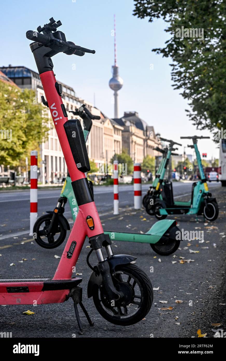 Berlin, Germany. 12th Sep, 2023. A few e-scooters stand in a row on a ...