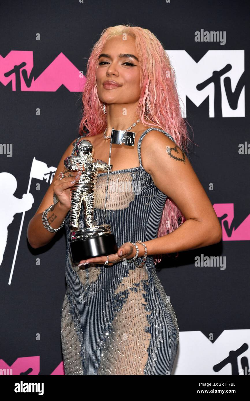 Karol G, winner of the award for best collaboration for "TQG", poses in ...