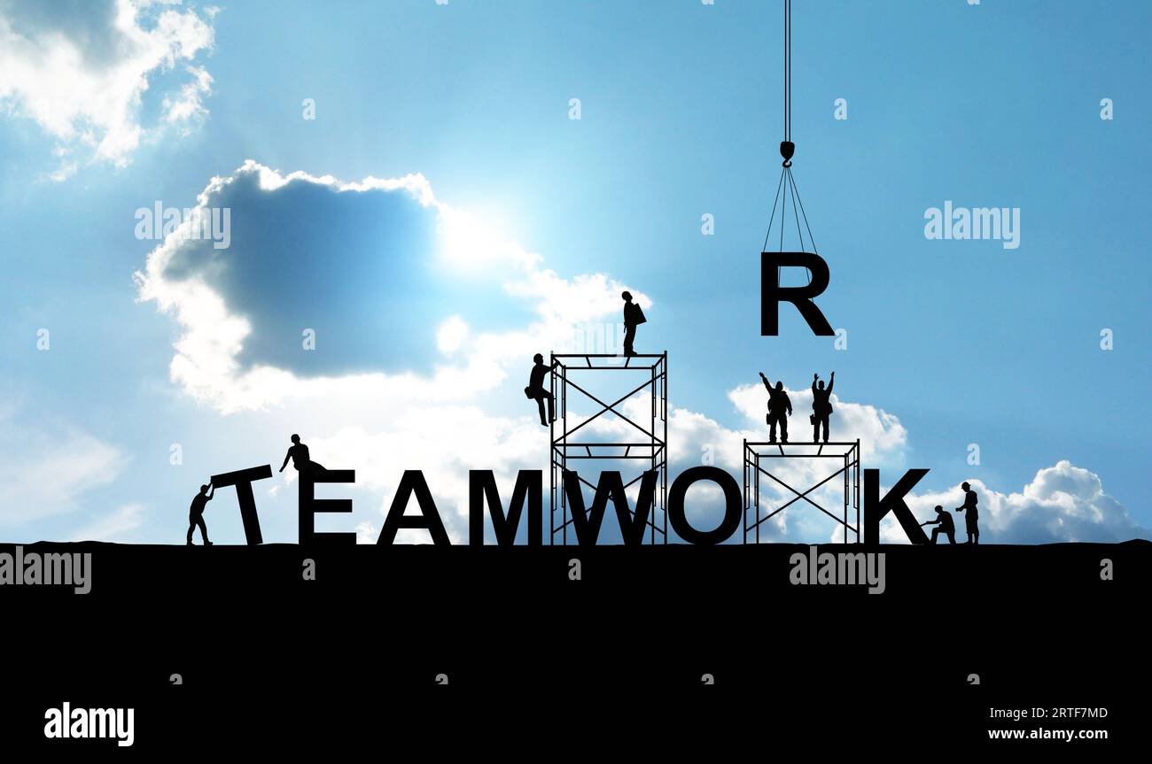 Silhouette of construction workers as a team working together to put ...