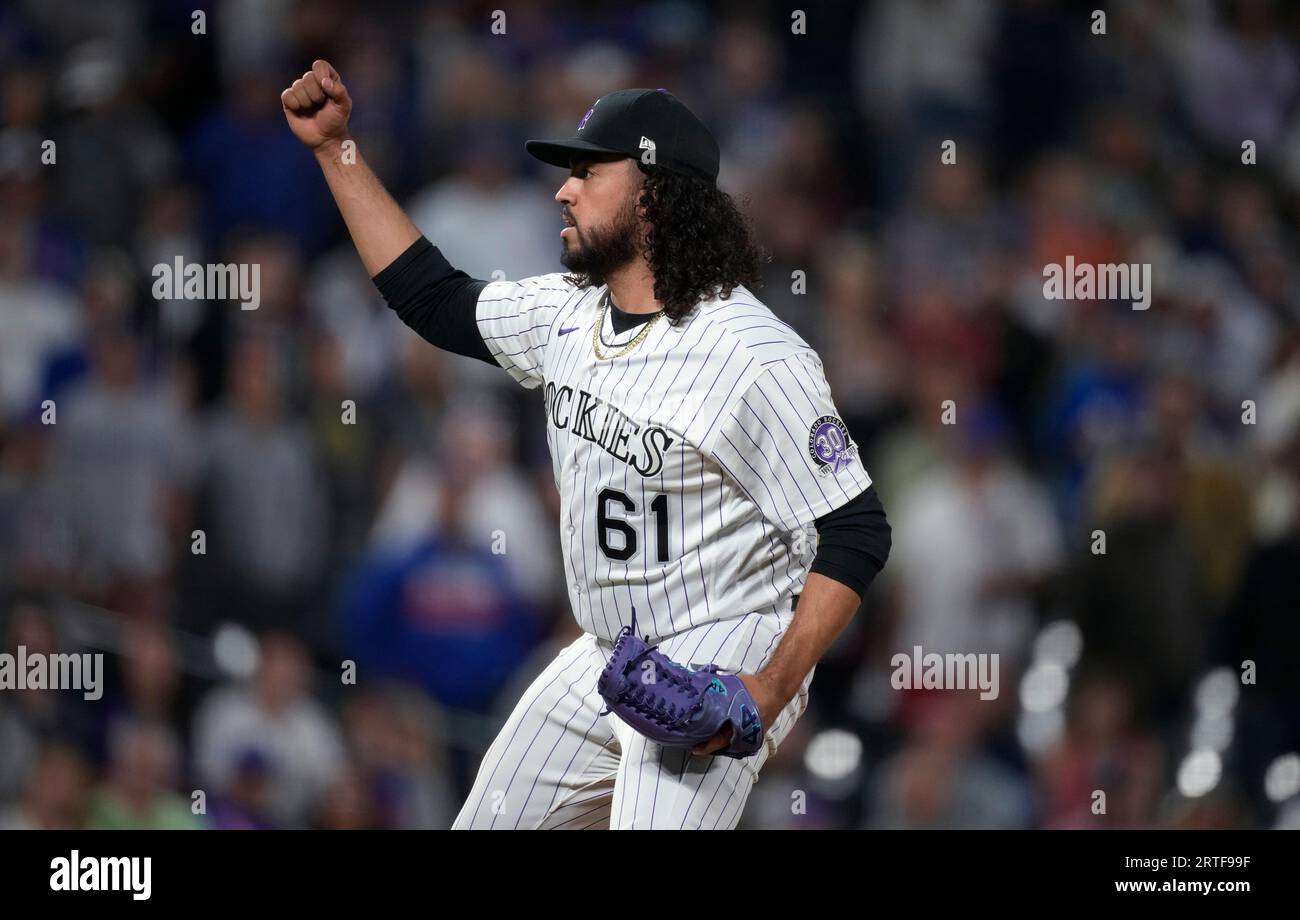 Colorado Rockies relief pitcher Justin Lawrence reacts after retiring ...