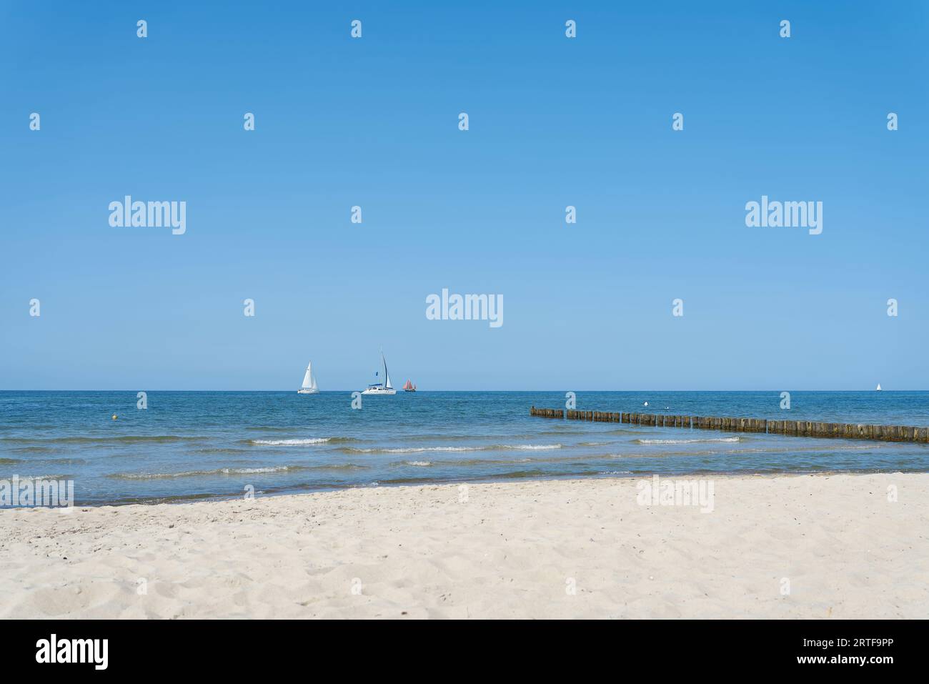 Beach near Kuehlungsborn on the German Baltic Sea with blue sky and ...