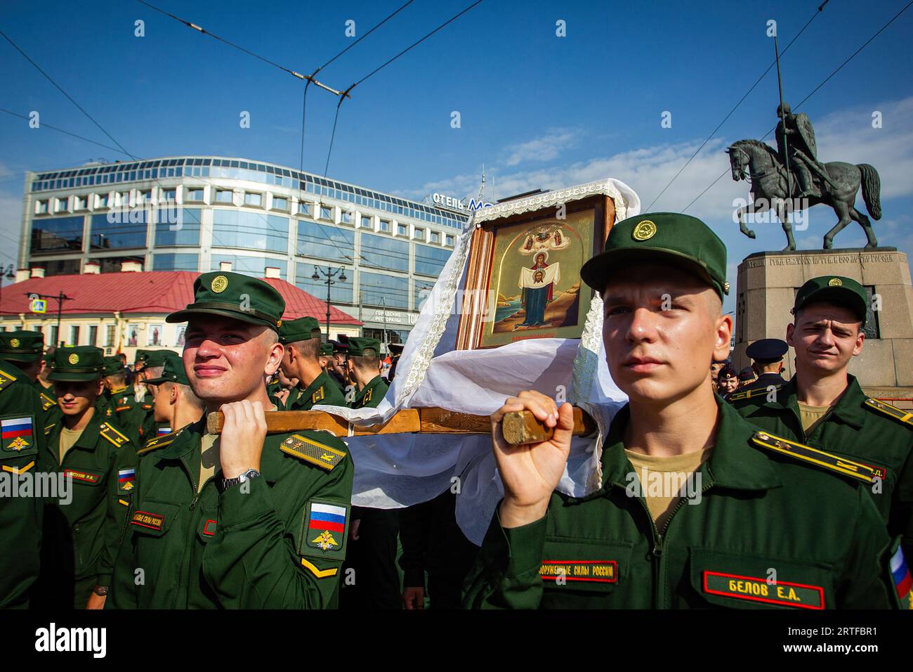 Military personnel at Alexander Nevsky Square carry an icon during the ...