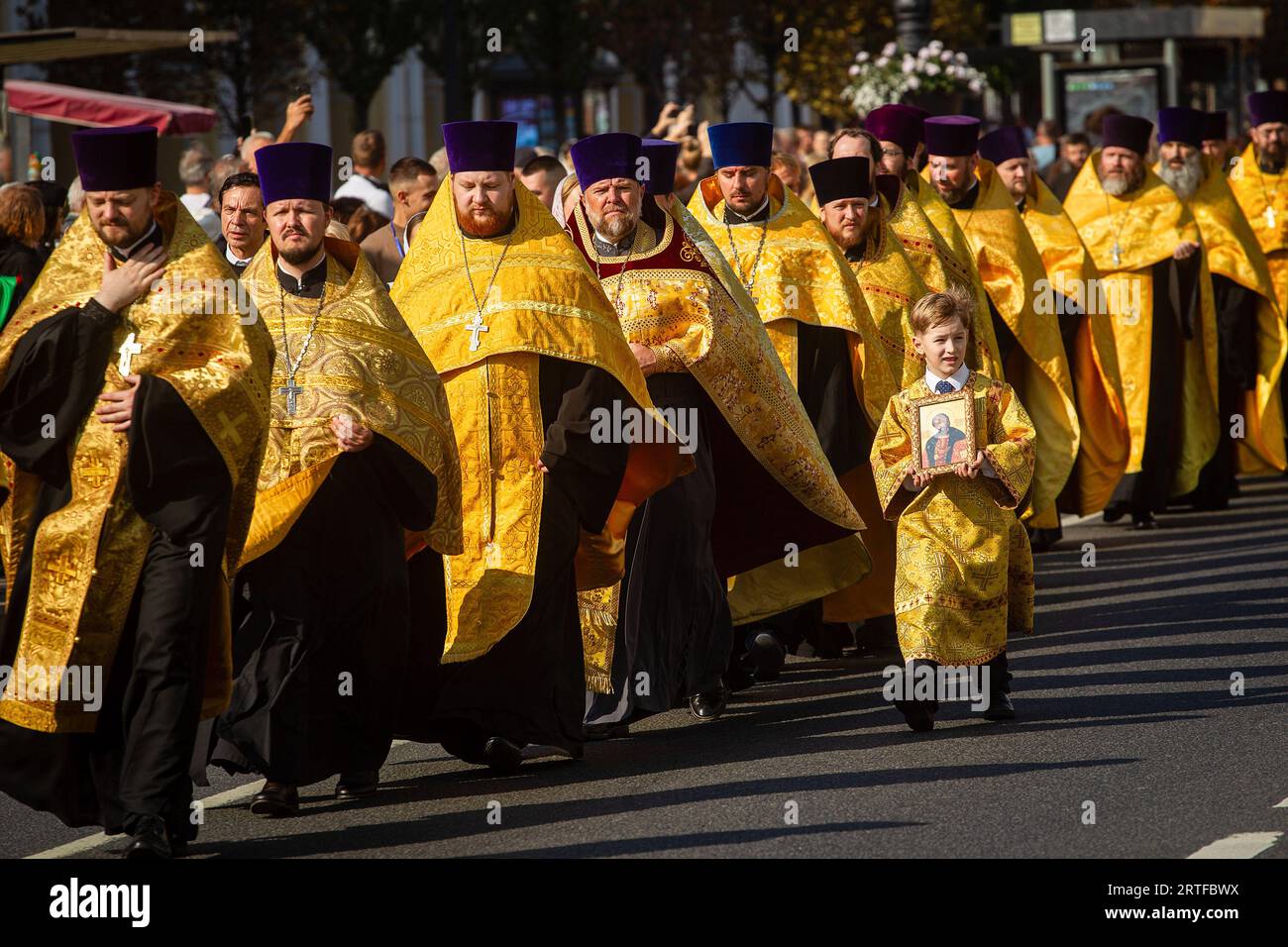 Orthodox priests walk during a religious procession along Nevsky ...