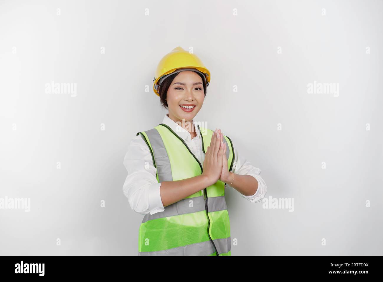 Friendly Asian woman labor worker in industry factory, gesturing ...