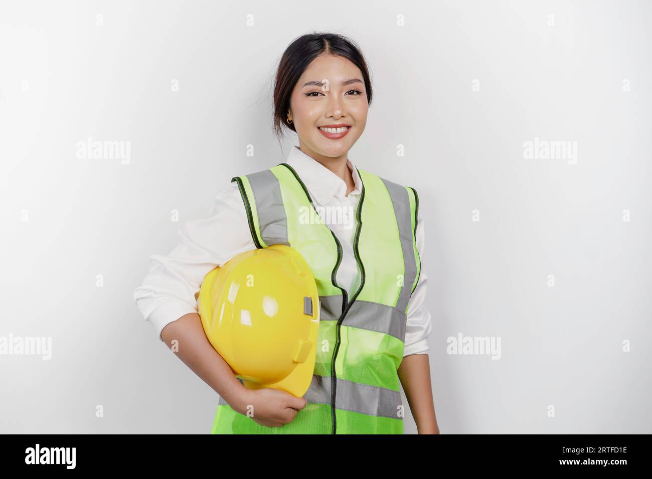 Confident Asian woman labor worker is smiling to the camera, bringing ...