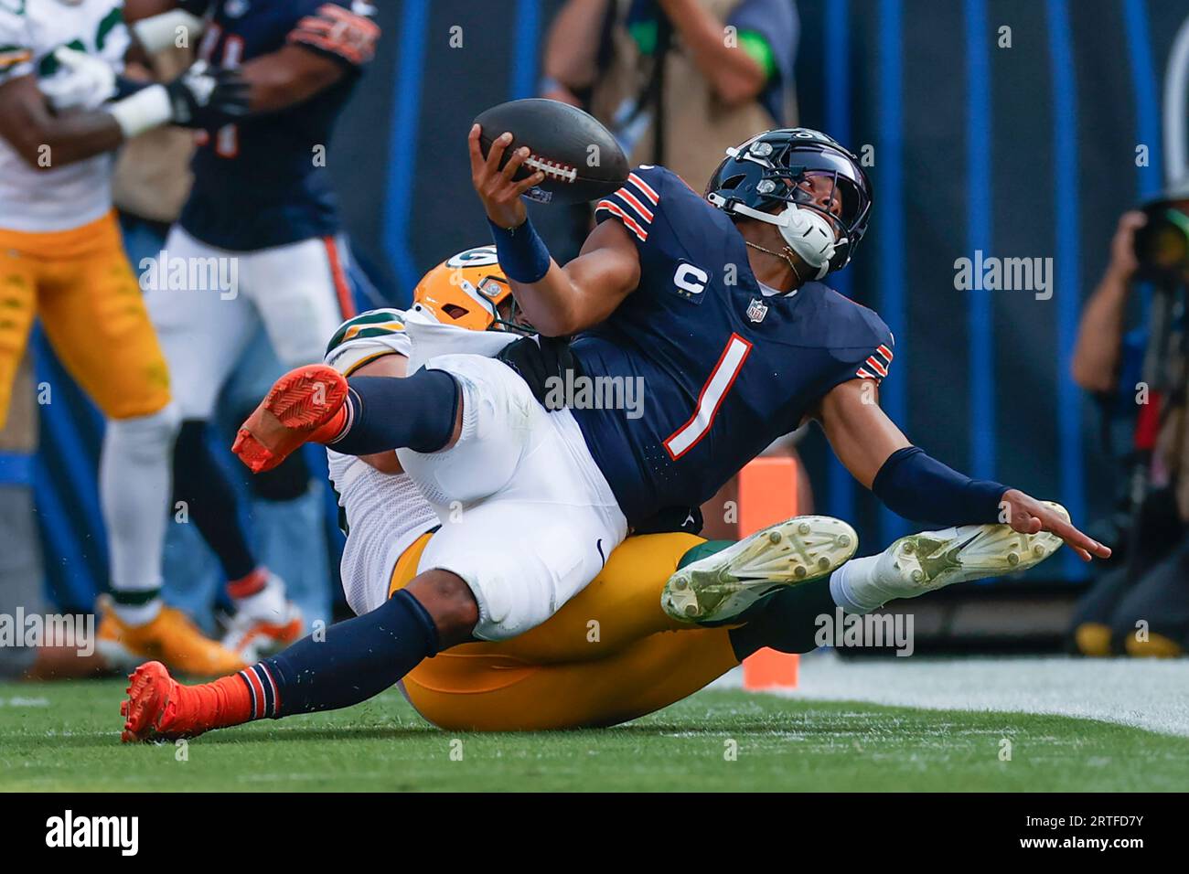 Chicago Bears quarterback Justin Fields (1) is tackled by Green Bay ...