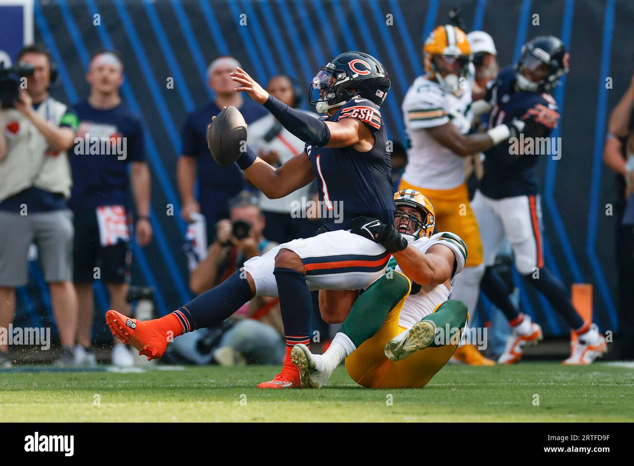 Chicago Bears quarterback Justin Fields (1) is tackled by Green Bay ...