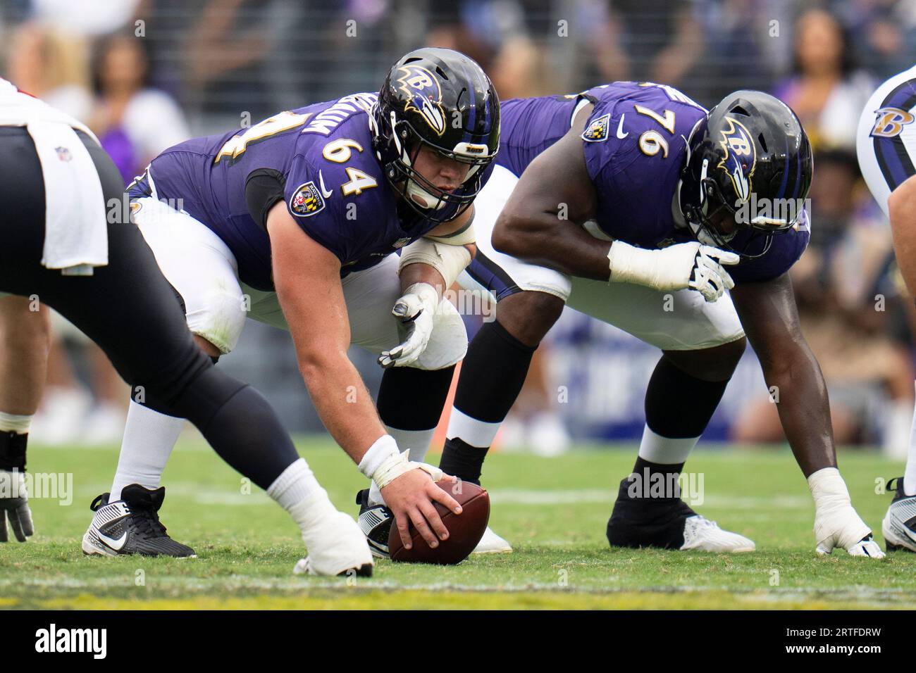 Baltimore Ravens center Tyler Linderbaum (64) and guard John Simpson ...