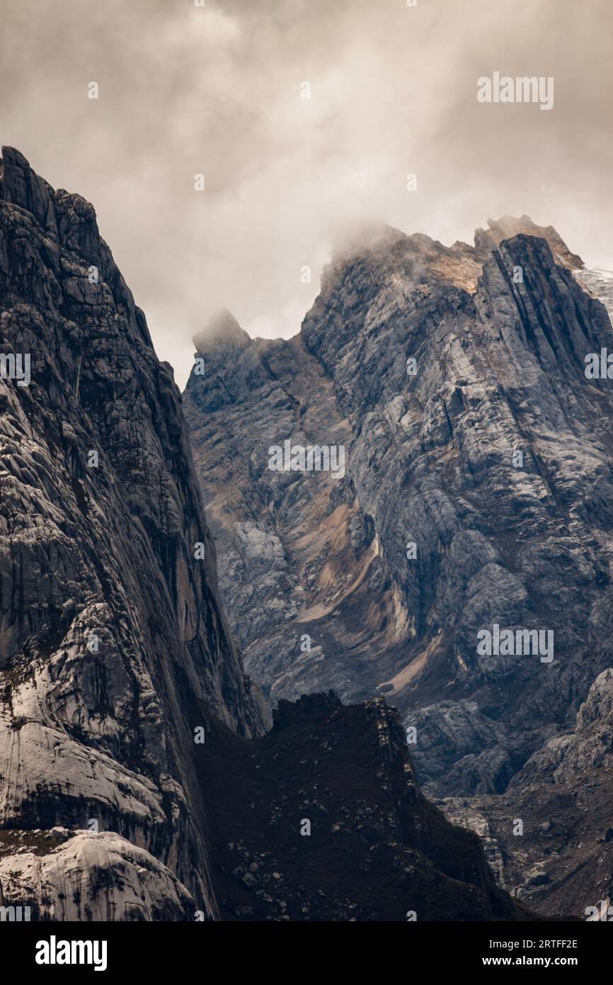The clouds covering the rugged mountains near Grasberg open pit mine in ...