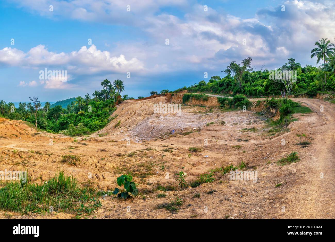 The barren landscape of a garbage landfill on tropical Mindoro Island ...