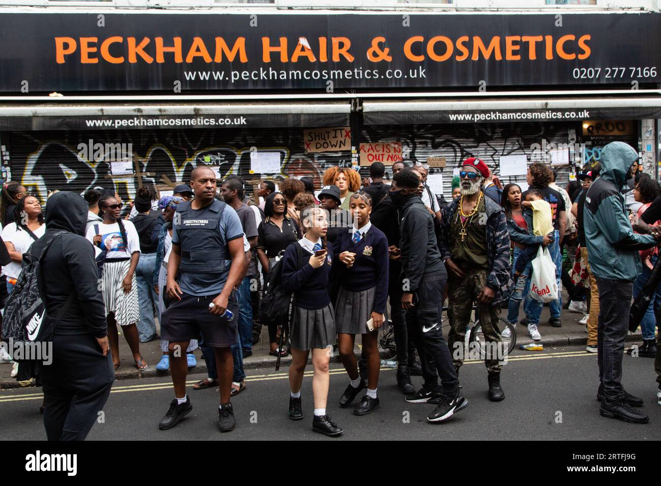 London, UK. 12th Sep, 2023. Protesters gather outside Peckham Hair and ...