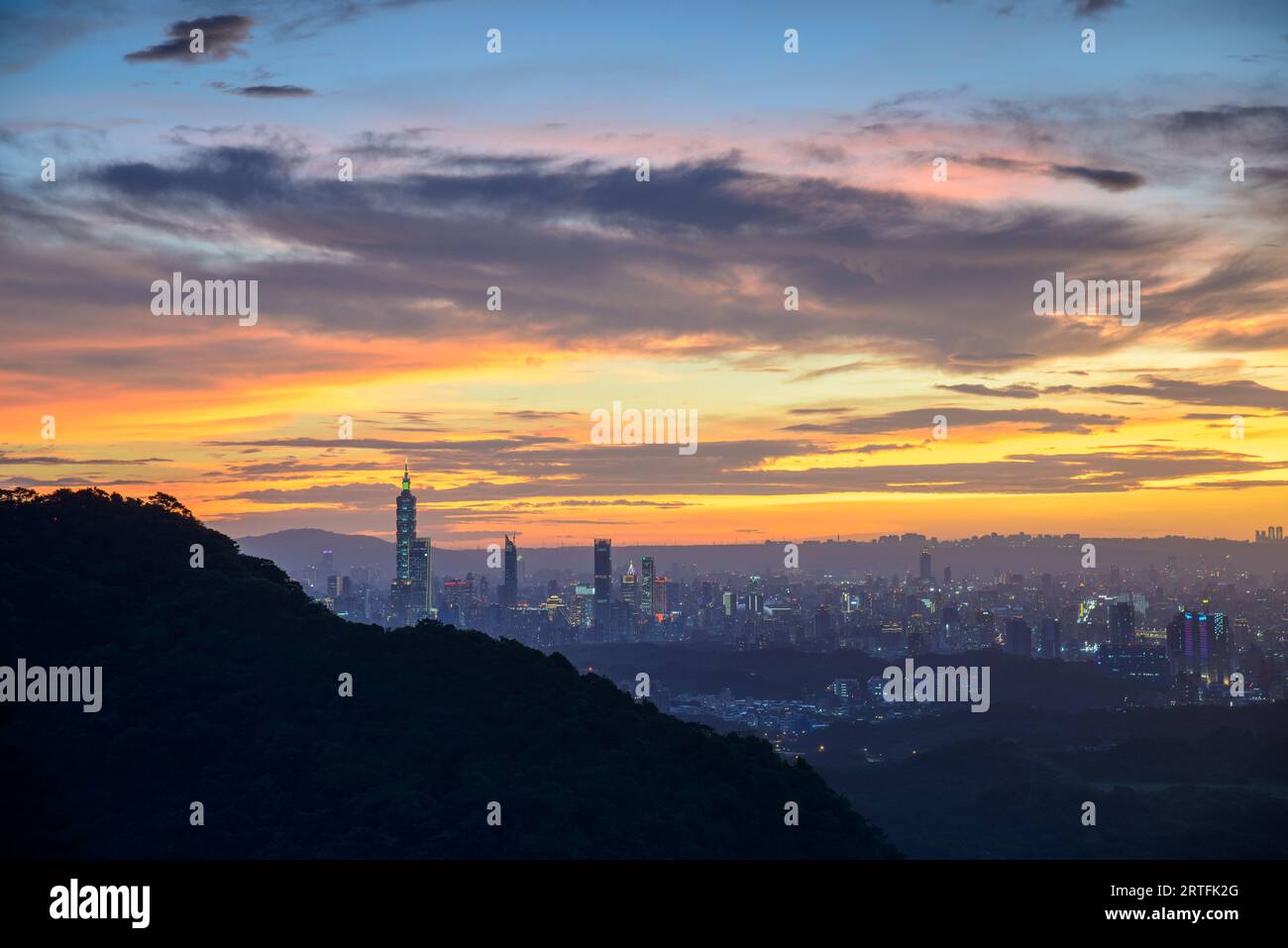 Fantasy orange sky. The vibrant and bustling night scene of Taipei City ...