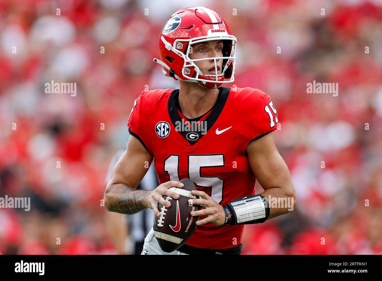 Georgia Bulldogs quarterback Carson Beck (15) looks for an open receiver during a college ...