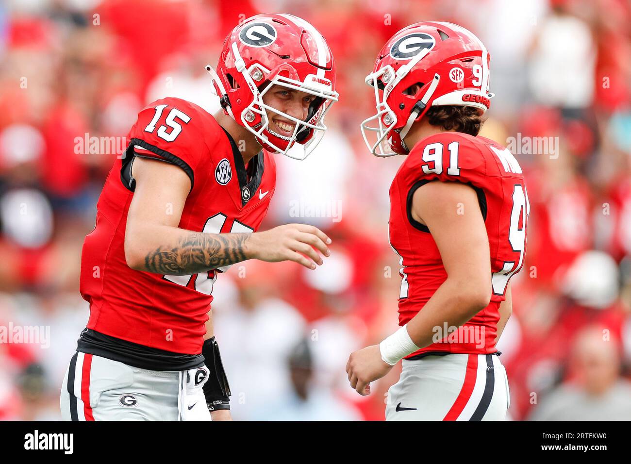 Georgia Bulldogs quarterback Carson Beck (15) celebrates with place ...