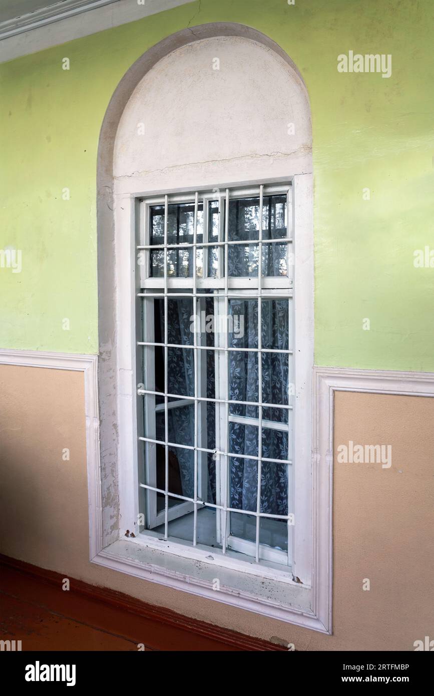 Old window with bars on the wall of a rural house Stock Photo - Alamy