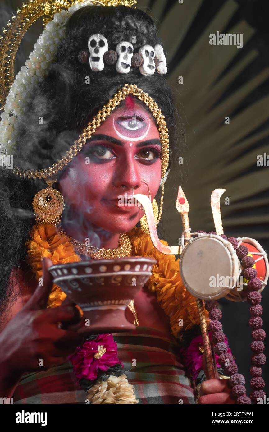 Portrait of beautiful Indian girl of Durga Idol Agomoni Concept Indoor ...