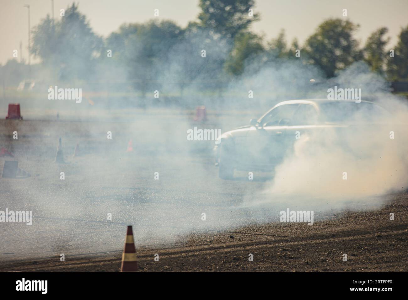 High-octane car drift race captured amidst swirling smoke, showcasing ...